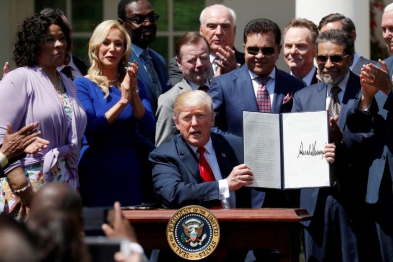 Trump signs order to give faith groups stronger voice in government ...