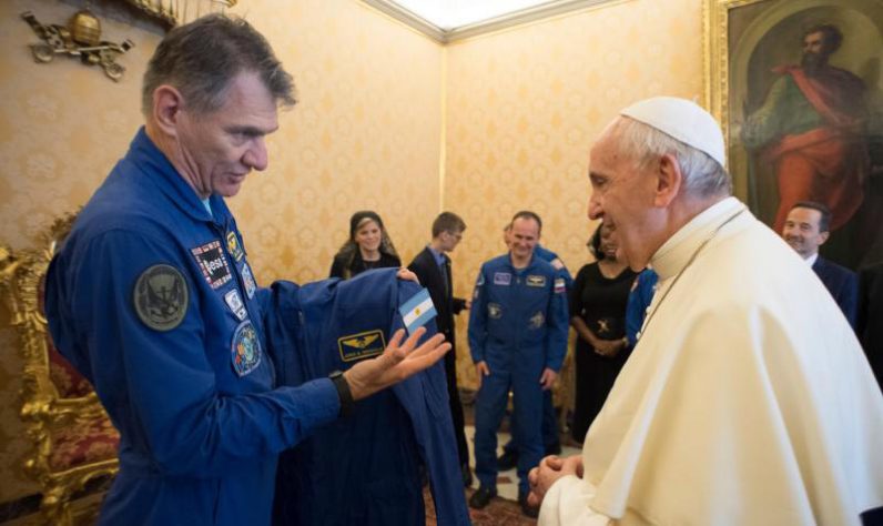 Space station crew members give pope custom-made blue flight suit ...